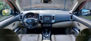 Black Mitsubishi Outlander 2011 in Tallinn, with an engine capacity of 2.40 L and mileage of 260 thousand km for 5790 €, photo 6 on AUTOMOTO.COM.LV