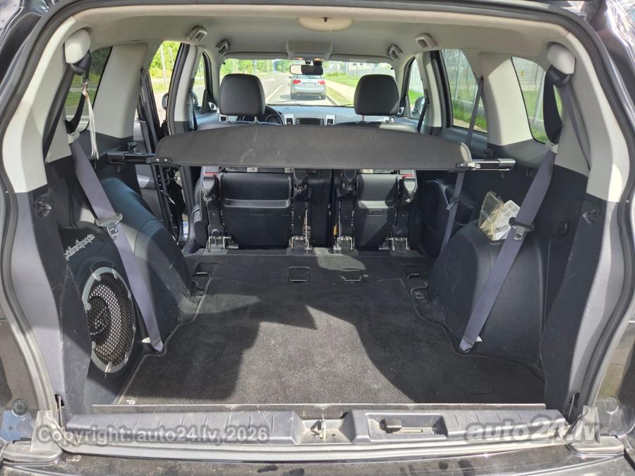 Black Mitsubishi Outlander 2012 in Tallinn, with an engine capacity of 2.40 L and mileage of 208 thousand km for 6900 €, photo 20 on AUTOMOTO.COM.LV