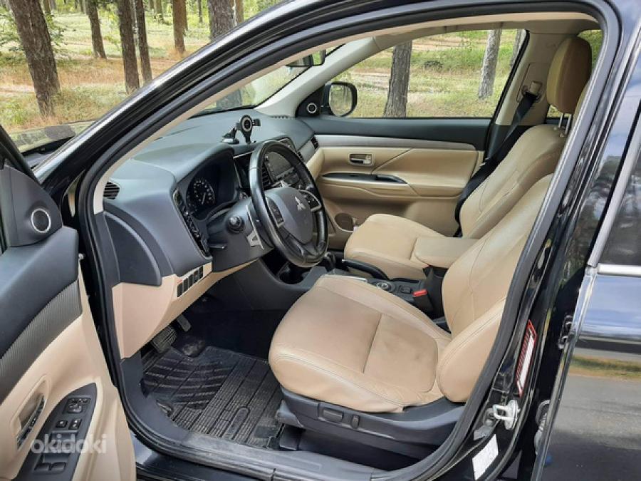 Black Mitsubishi Outlander 2014 in Tallinn, with an engine capacity of 2.00 L and mileage of 230 thousand km for 6500 €, photo 4 on AUTOMOTO.COM.LV