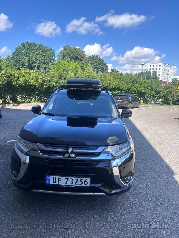 Black Mitsubishi Outlander 2016 in Parnu, with an engine capacity of 2.00 L and mileage of 174 thousand km for 12600 €, photo 2 on AUTOMOTO.COM.LV