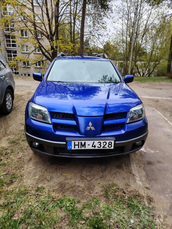 Blue Mitsubishi Outlander 2007 in Riga, with an engine capacity of 2.00 L and mileage of 204 thousand km for 2200 €, photo 1 on AUTOMOTO.COM.LV