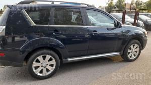 Blue Mitsubishi Outlander 2012 in Riga, with an engine capacity of 2.20 L and mileage of 212 thousand km for 6900 €, photo 11 on AUTOMOTO.COM.LV