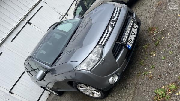 Zils Mitsubishi Outlander 2013 Kauņa, ar dzinēja tilpumu 2.00 L un nobraukumu 292 tūkst. km par 3200 €, foto 3 vietnē AUTOMOTO.COM.LV