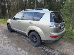 Brūns Mitsubishi Outlander 2008 Rīga, ar dzinēja tilpumu 2.40 L un nobraukumu 284 tūkst. km par 3550 €, foto 4 vietnē AUTOMOTO.COM.LV