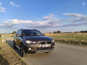 Brown Mitsubishi Outlander 2011 in Siauliai, with an engine capacity of 2.27 L and mileage of 297 thousand km for 5700 €, photo  on AUTOMOTO.COM.LV
