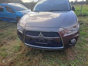 Brūns Mitsubishi Outlander 2012 Tauragė, ar dzinēja tilpumu 2.20 L un nobraukumu 264 tūkst. km par 3150 €, foto 4 vietnē AUTOMOTO.COM.LV