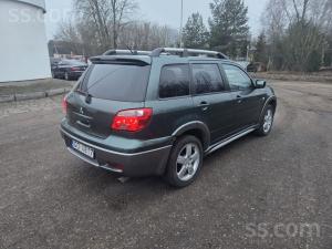 Zaļš Mitsubishi Outlander 2007 Daugavpils, ar dzinēja tilpumu 2.40 L un nobraukumu 0 tūkst. km par 2499 €, foto 7 vietnē AUTOMOTO.COM.LV