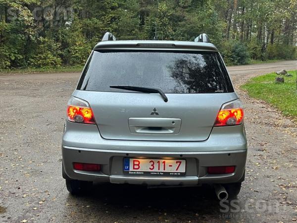 Pelēks Mitsubishi Outlander 2005 Rīga, ar dzinēja tilpumu 2.40 L un nobraukumu 0 tūkst. km par 2799 €, foto 5 vietnē AUTOMOTO.COM.LV