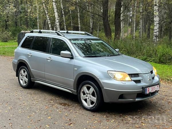 Pelēks Mitsubishi Outlander 2005 Rīga, ar dzinēja tilpumu 2.40 L un nobraukumu 0 tūkst. km par 2799 €, foto 8 vietnē AUTOMOTO.COM.LV