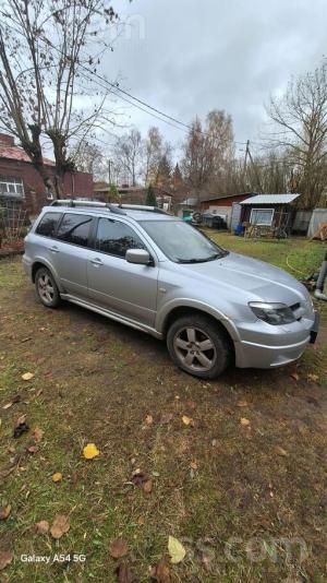 Grey Mitsubishi Outlander 2006 in Riga, with an engine capacity of 2.40 L and mileage of 371 thousand km for 1100 €, photo  on AUTOMOTO.COM.LV