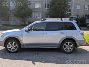 Pelēks Mitsubishi Outlander 2006 Rīga, ar dzinēja tilpumu 2.40 L un nobraukumu 219 tūkst. km par 3100 €, foto 7 vietnē AUTOMOTO.COM.LV