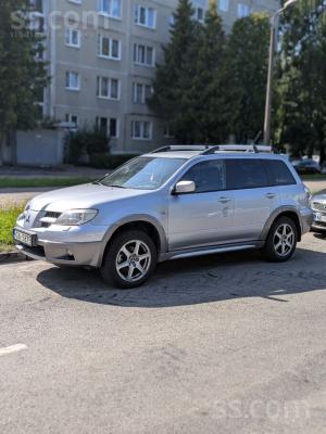 Pelēks Mitsubishi Outlander 2006 Rīga, ar dzinēja tilpumu 2.40 L un nobraukumu 219 tūkst. km par 3100 €, foto 8 vietnē AUTOMOTO.COM.LV