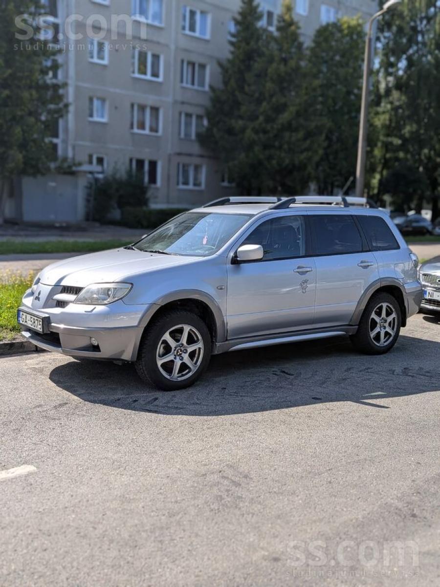 Pelēks Mitsubishi Outlander 2006 Rīga, ar dzinēja tilpumu 2.40 L un nobraukumu 219 tūkst. km par 3100 €, foto 8 vietnē AUTOMOTO.COM.LV