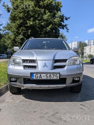 Pelēks Mitsubishi Outlander 2006 Rīga, ar dzinēja tilpumu 2.40 L un nobraukumu 219 tūkst. km par 3100 €, foto 9 vietnē AUTOMOTO.COM.LV