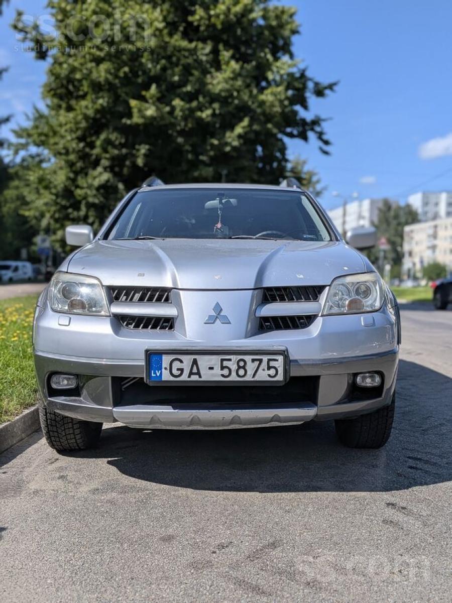 Pelēks Mitsubishi Outlander 2006 Rīga, ar dzinēja tilpumu 2.40 L un nobraukumu 219 tūkst. km par 3100 €, foto 9 vietnē AUTOMOTO.COM.LV
