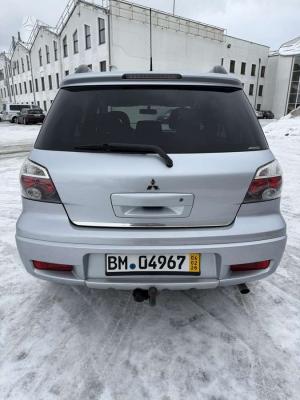 Pelēks Mitsubishi Outlander 2007 Kauņa, ar dzinēja tilpumu 2.38 L un nobraukumu 107 tūkst. km par 5700 €, foto 9 vietnē AUTOMOTO.COM.LV