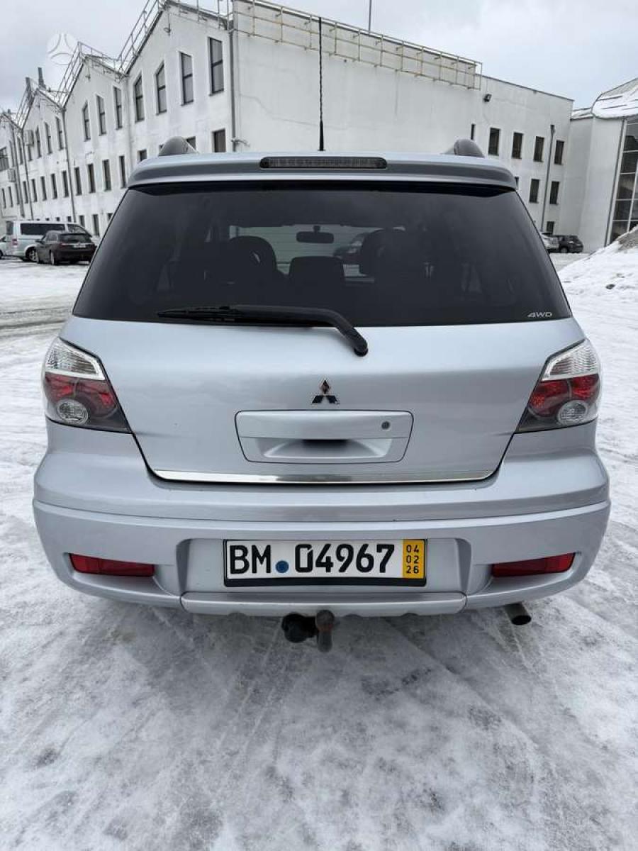 Pelēks Mitsubishi Outlander 2007 Kauņa, ar dzinēja tilpumu 2.38 L un nobraukumu 107 tūkst. km par 5700 €, foto 9 vietnē AUTOMOTO.COM.LV