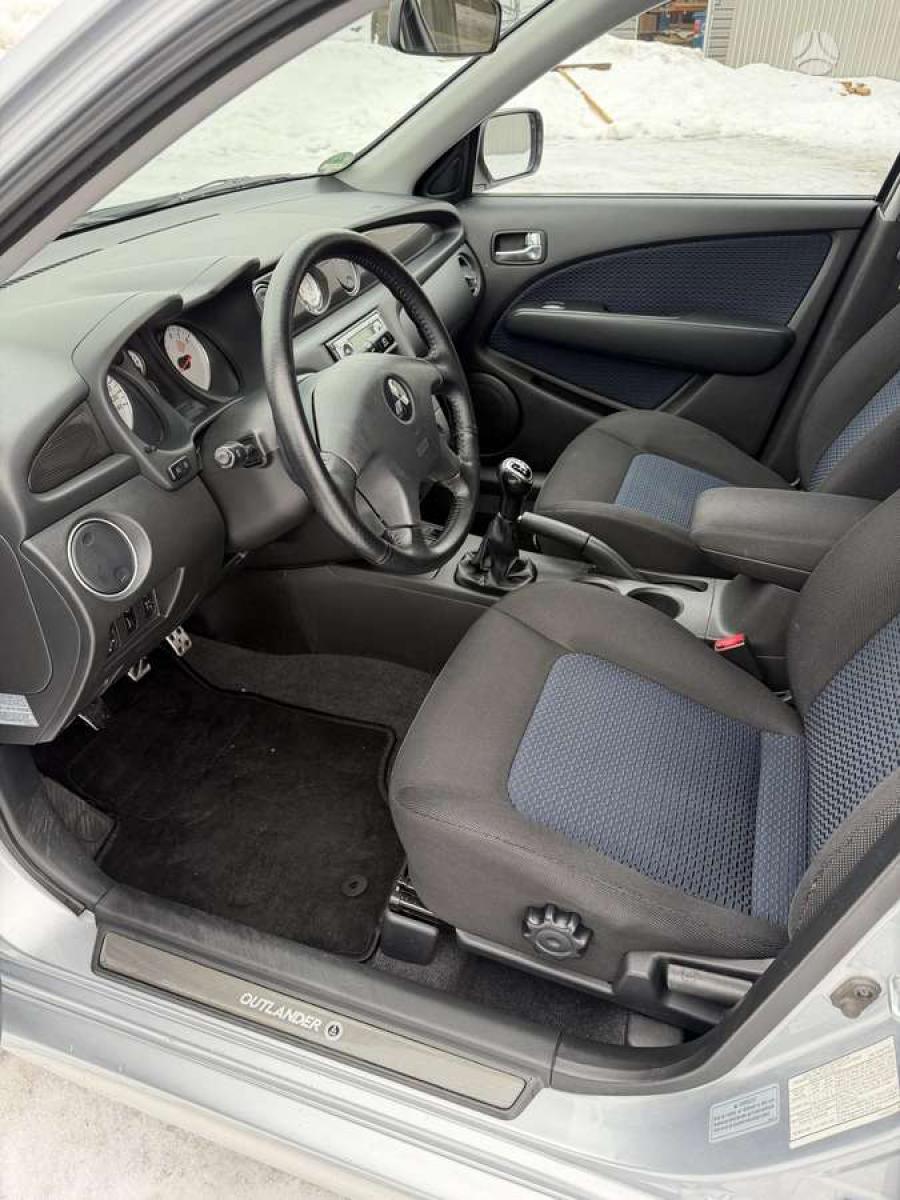 Pelēks Mitsubishi Outlander 2007 Kauņa, ar dzinēja tilpumu 2.38 L un nobraukumu 107 tūkst. km par 5700 €, foto 18 vietnē AUTOMOTO.COM.LV