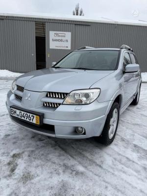 Pelēks Mitsubishi Outlander 2007 Kauņa, ar dzinēja tilpumu 2.38 L un nobraukumu 107 tūkst. km par 5700 €, foto 32 vietnē AUTOMOTO.COM.LV