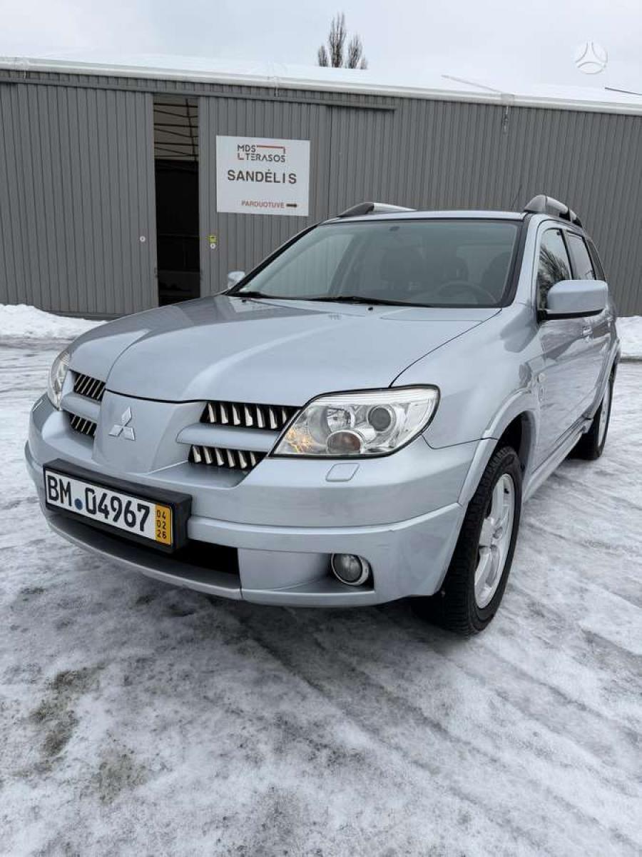 Pelēks Mitsubishi Outlander 2007 Kauņa, ar dzinēja tilpumu 2.38 L un nobraukumu 107 tūkst. km par 5700 €, foto 32 vietnē AUTOMOTO.COM.LV