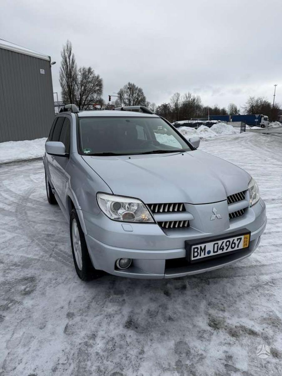 Pelēks Mitsubishi Outlander 2007 Kauņa, ar dzinēja tilpumu 2.38 L un nobraukumu 107 tūkst. km par 5700 €, foto 33 vietnē AUTOMOTO.COM.LV