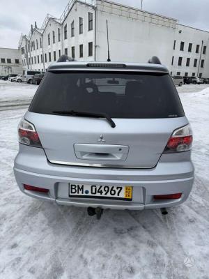 Pelēks Mitsubishi Outlander 2007 Kauņa, ar dzinēja tilpumu 2.38 L un nobraukumu 107 tūkst. km par 5700 €, foto 34 vietnē AUTOMOTO.COM.LV
