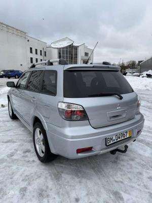 Pelēks Mitsubishi Outlander 2007 Kauņa, ar dzinēja tilpumu 2.38 L un nobraukumu 107 tūkst. km par 5700 €, foto 35 vietnē AUTOMOTO.COM.LV