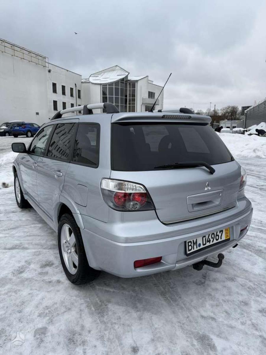 Pelēks Mitsubishi Outlander 2007 Kauņa, ar dzinēja tilpumu 2.38 L un nobraukumu 107 tūkst. km par 5700 €, foto 35 vietnē AUTOMOTO.COM.LV