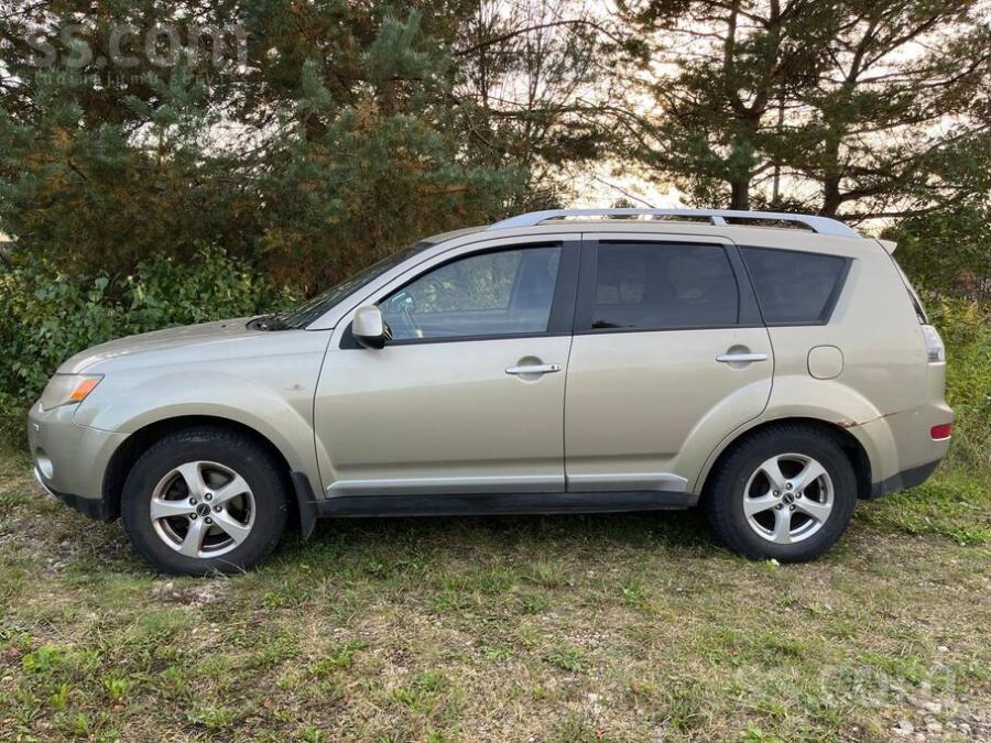 Pelēks Mitsubishi Outlander 2007 Rīga, ar dzinēja tilpumu 2.40 L un nobraukumu 215 tūkst. km par 2100 €, foto 6 vietnē AUTOMOTO.COM.LV
