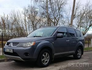 Pelēks Mitsubishi Outlander 2008 Rīga, ar dzinēja tilpumu 2.40 L un nobraukumu 265 tūkst. km par 5000 €, foto  vietnē AUTOMOTO.COM.LV
