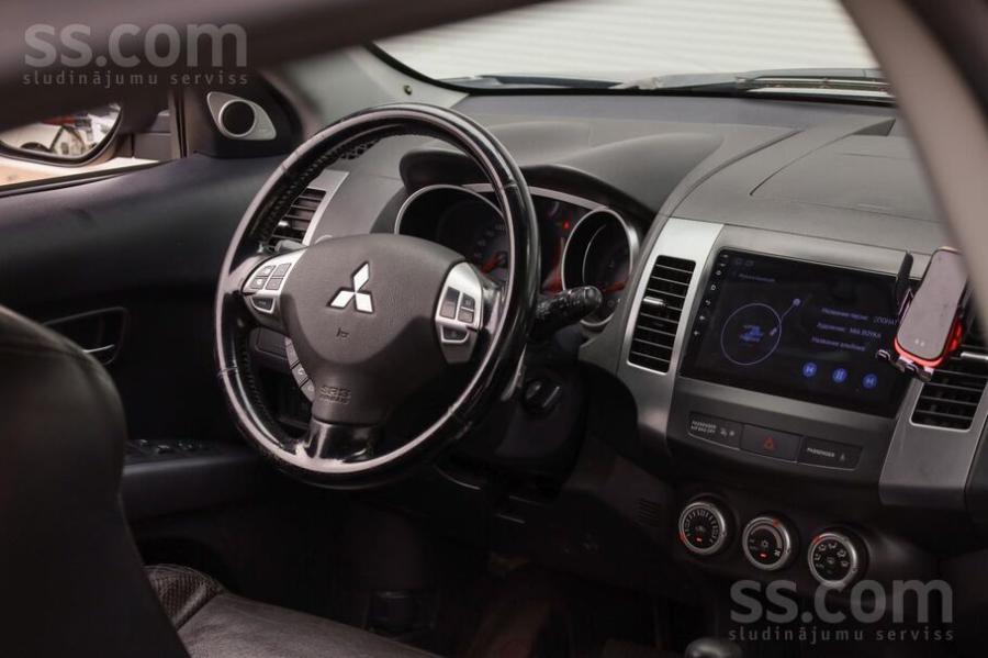 Pelēks Mitsubishi Outlander 2008 Rīga, ar dzinēja tilpumu 2.40 L un nobraukumu 308 tūkst. km par 3495 €, foto 20 vietnē AUTOMOTO.COM.LV