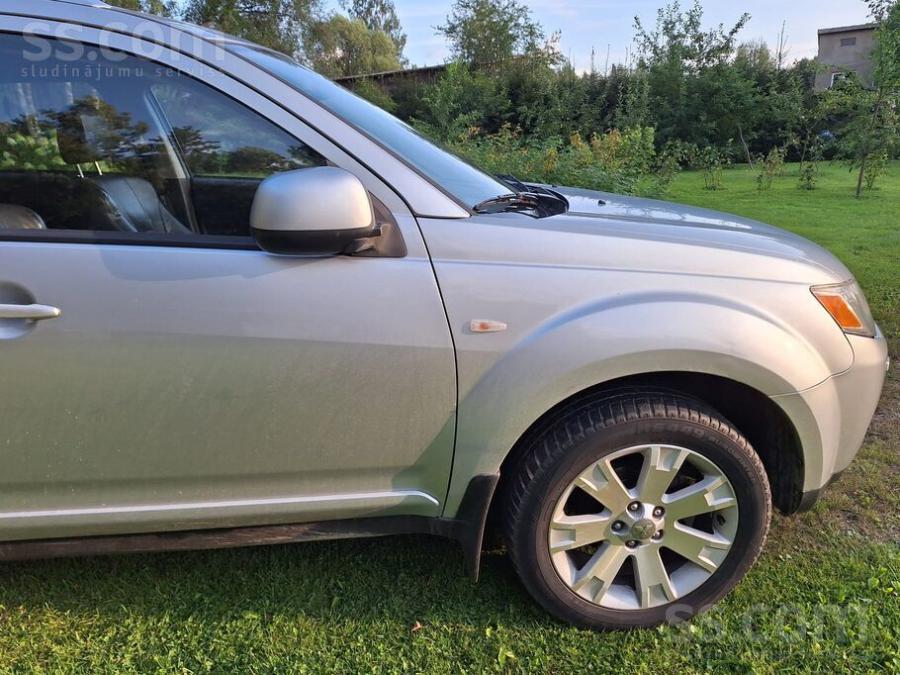 Pelēks Mitsubishi Outlander 2009 Rīga, ar dzinēja tilpumu 2.40 L un nobraukumu 304 tūkst. km par 4300 €, foto 11 vietnē AUTOMOTO.COM.LV