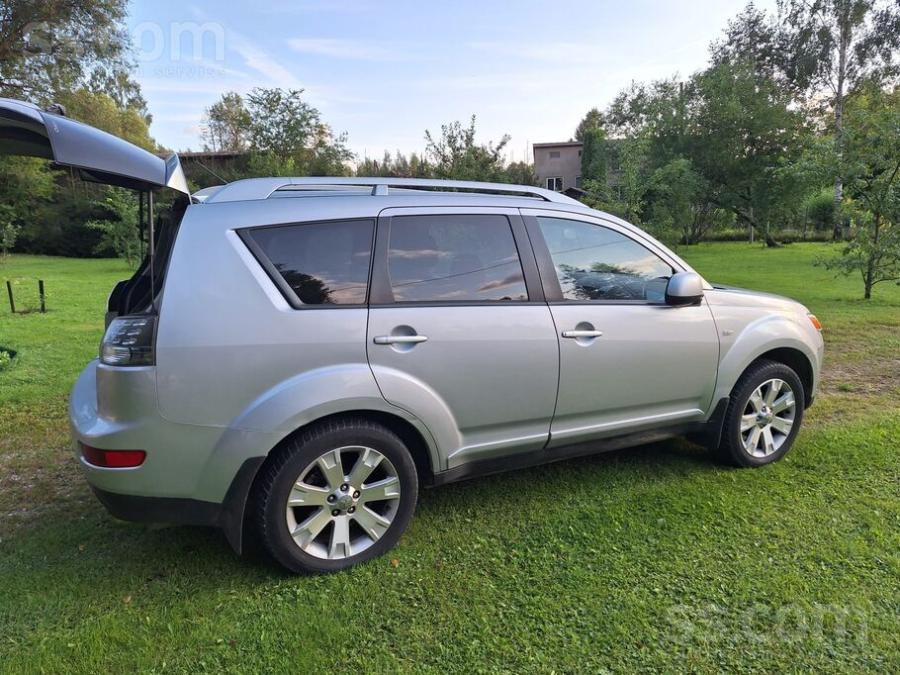 Pelēks Mitsubishi Outlander 2009 Rīga, ar dzinēja tilpumu 2.40 L un nobraukumu 304 tūkst. km par 4300 €, foto 12 vietnē AUTOMOTO.COM.LV