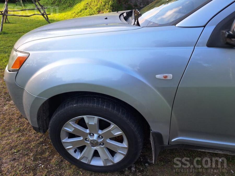Pelēks Mitsubishi Outlander 2009 Rīga, ar dzinēja tilpumu 2.40 L un nobraukumu 304 tūkst. km par 4300 €, foto 13 vietnē AUTOMOTO.COM.LV