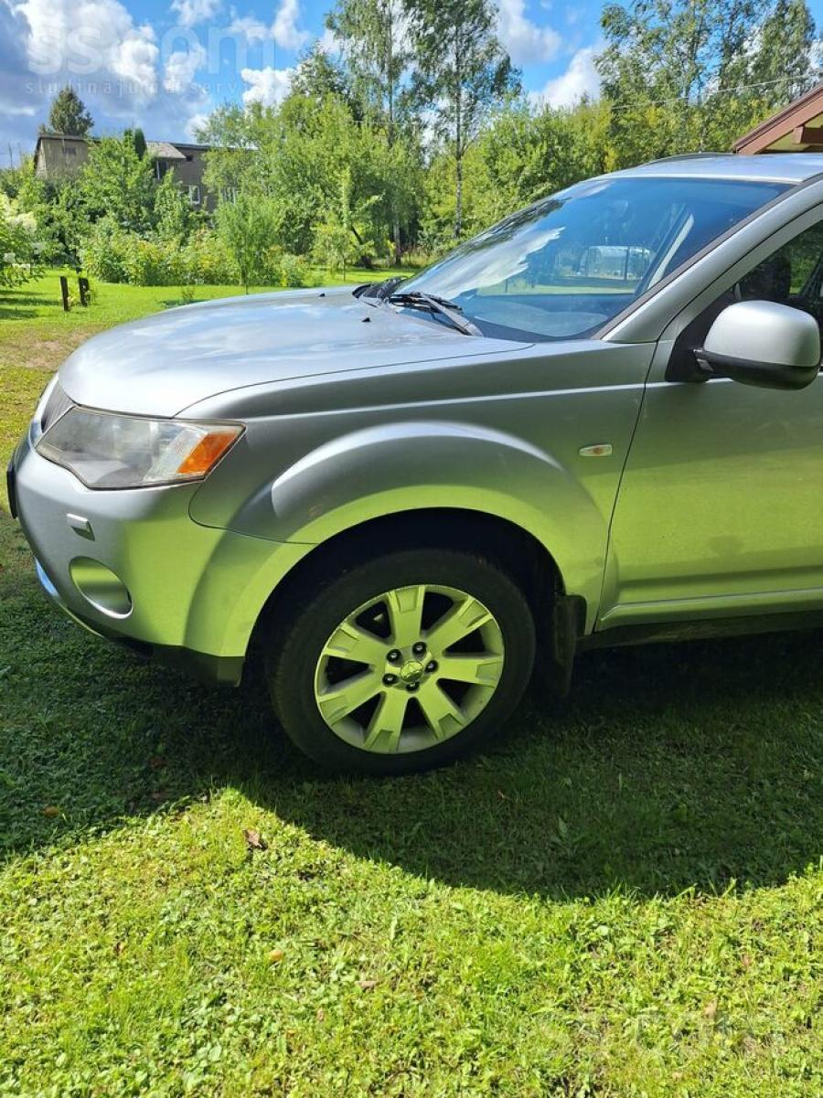 Pelēks Mitsubishi Outlander 2009 Rīga, ar dzinēja tilpumu 2.40 L un nobraukumu 304 tūkst. km par 4300 €, foto 14 vietnē AUTOMOTO.COM.LV