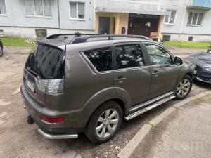 Pelēks Mitsubishi Outlander 2011 Rīga, ar dzinēja tilpumu 2.40 L un nobraukumu 205 tūkst. km par 5250 €, foto 4 vietnē AUTOMOTO.COM.LV