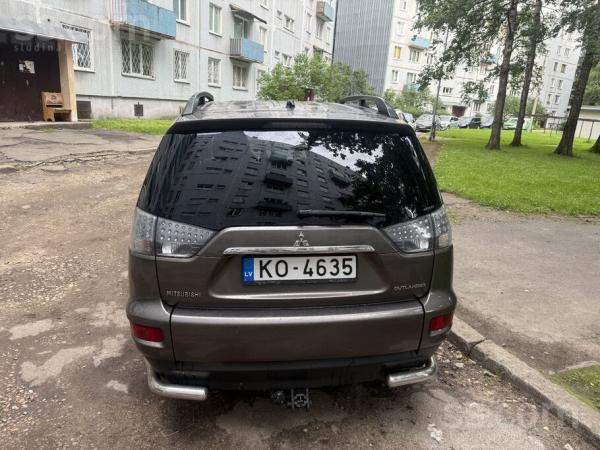 Pelēks Mitsubishi Outlander 2011 Rīga, ar dzinēja tilpumu 2.40 L un nobraukumu 205 tūkst. km par 5250 €, foto 4 vietnē AUTOMOTO.COM.LV