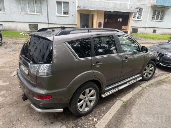 Pelēks Mitsubishi Outlander 2011 Rīga, ar dzinēja tilpumu 2.40 L un nobraukumu 205 tūkst. km par 5250 €, foto 6 vietnē AUTOMOTO.COM.LV