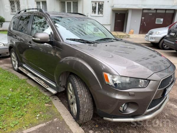 Pelēks Mitsubishi Outlander 2011 Rīga, ar dzinēja tilpumu 2.40 L un nobraukumu 206 tūkst. km par 5200 €, foto 6 vietnē AUTOMOTO.COM.LV
