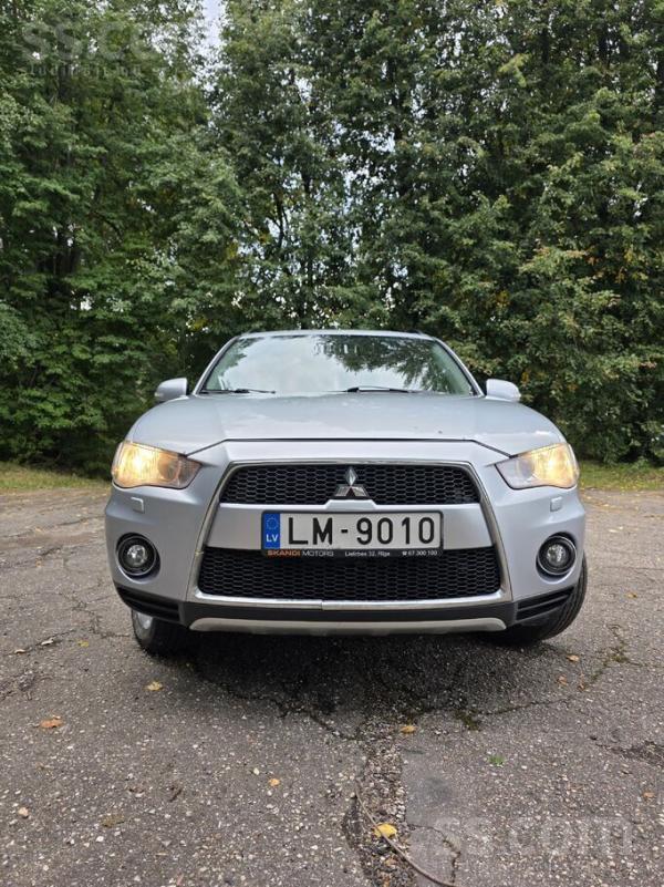 Pelēks Mitsubishi Outlander 2011 Rīga, ar dzinēja tilpumu 2.20 L un nobraukumu 330 tūkst. km par 4200 €, foto 9 vietnē AUTOMOTO.COM.LV