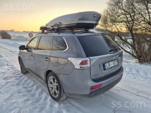 Grey Mitsubishi Outlander 2013 in Riga, with an engine capacity of 2.20 L and mileage of 260 thousand km for 8200 €, photo 3 on AUTOMOTO.COM.LV