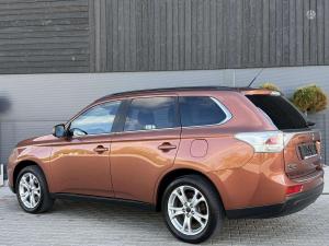 Orange Mitsubishi Outlander 2012 in Siauliai, with an engine capacity of 2.27 L and mileage of 243 thousand km for 8450 €, photo 8 on AUTOMOTO.COM.LV