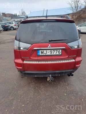 Sarkans Mitsubishi Outlander 2010 Daugavpils, ar dzinēja tilpumu 2.20 L un nobraukumu 245 tūkst. km par 3650 €, foto 2 vietnē AUTOMOTO.COM.LV
