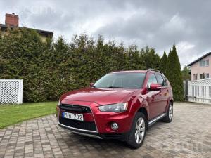 Sarkans Mitsubishi Outlander 2012 Rīga, ar dzinēja tilpumu 2.20 L un nobraukumu 288 tūkst. km par 5250 €, foto  vietnē AUTOMOTO.COM.LV