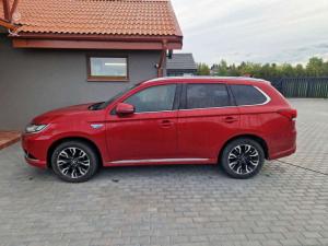 Red Mitsubishi Outlander 2015 in Palanga, with an engine capacity of 2.00 L and mileage of 291 thousand km for 8900 €, photo  on AUTOMOTO.COM.LV