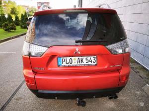 Red Mitsubishi Outlander 2009 in Klaipeda, with an engine capacity of 2.20 L and mileage of 216 thousand km for 4190 €, photo 6 on AUTOMOTO.COM.LV