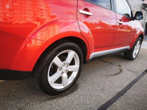 Red Mitsubishi Outlander 2009 in Klaipeda, with an engine capacity of 2.20 L and mileage of 216 thousand km for 4190 €, photo 11 on AUTOMOTO.COM.LV