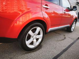 Red Mitsubishi Outlander 2009 in Klaipeda, with an engine capacity of 2.20 L and mileage of 216 thousand km for 4190 €, photo 11 on AUTOMOTO.COM.LV