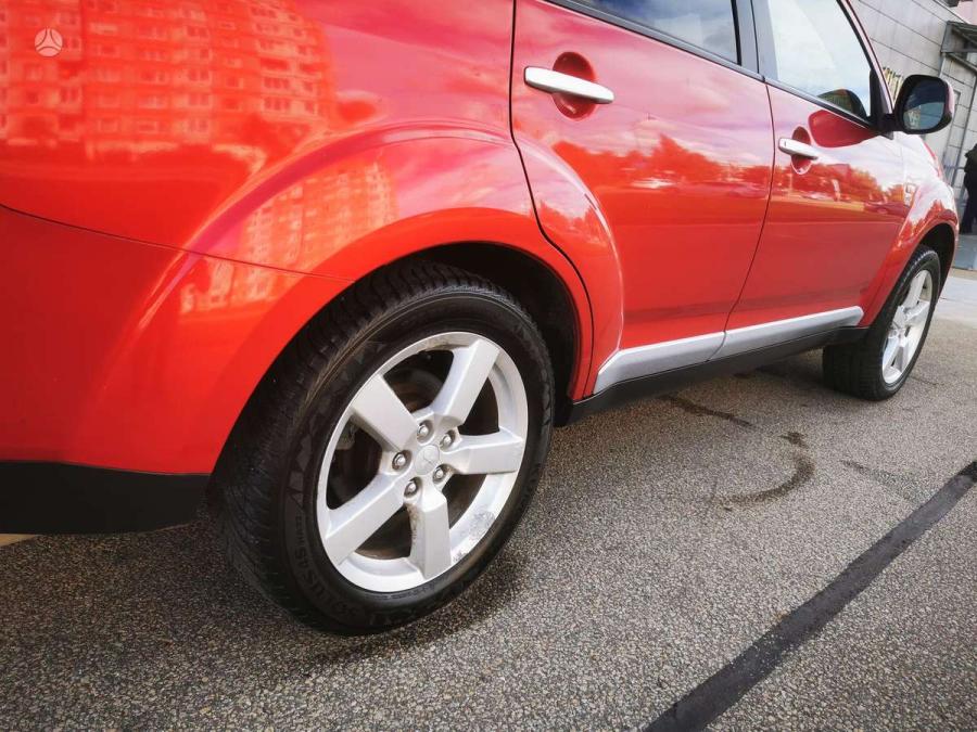 Red Mitsubishi Outlander 2009 in Klaipeda, with an engine capacity of 2.20 L and mileage of 216 thousand km for 4190 €, photo 11 on AUTOMOTO.COM.LV