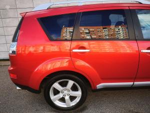 Red Mitsubishi Outlander 2009 in Klaipeda, with an engine capacity of 2.20 L and mileage of 216 thousand km for 4190 €, photo 14 on AUTOMOTO.COM.LV